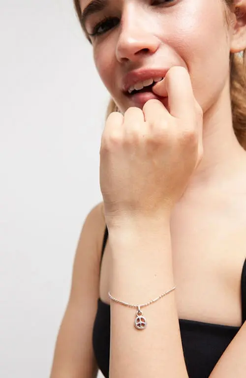 UNODE50 Charm With A Peace Symbol