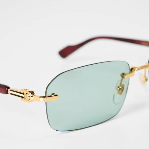 Gucci Rectangular Rimless Sunglasses With Gold Tone Accents