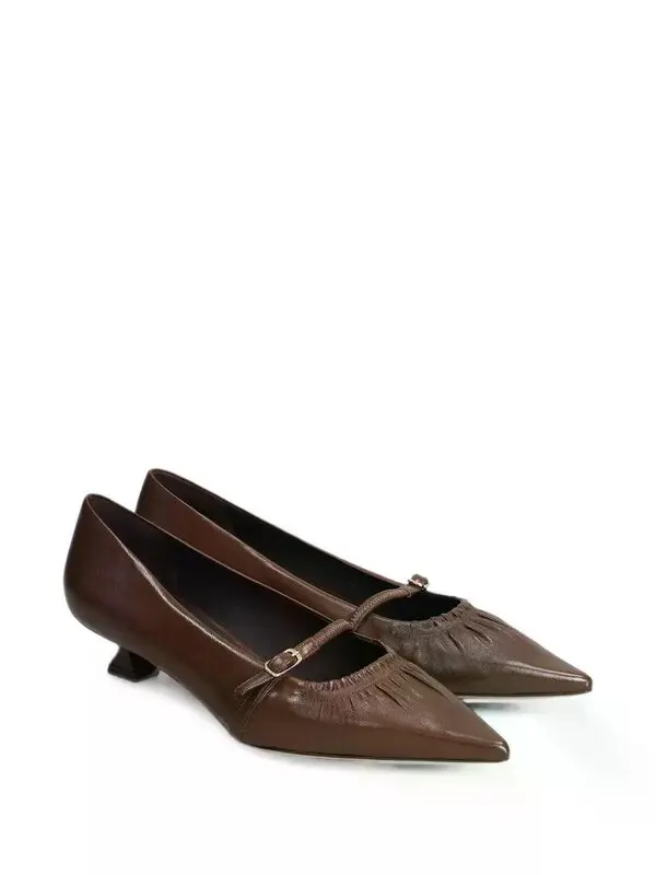 THE SELLER Pointed-toe Buckled Pumps