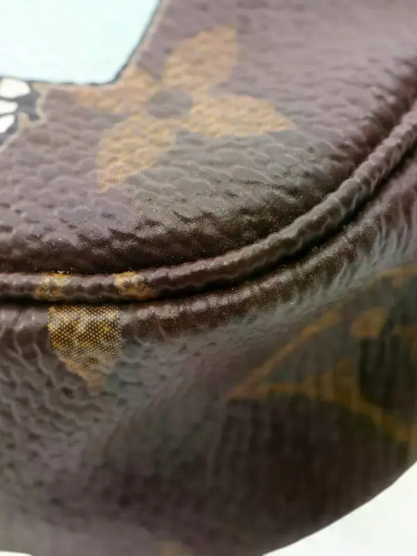 LOUIS VUITTON Monogram Illustre Mini Pochette Accessories Handbag - Brown