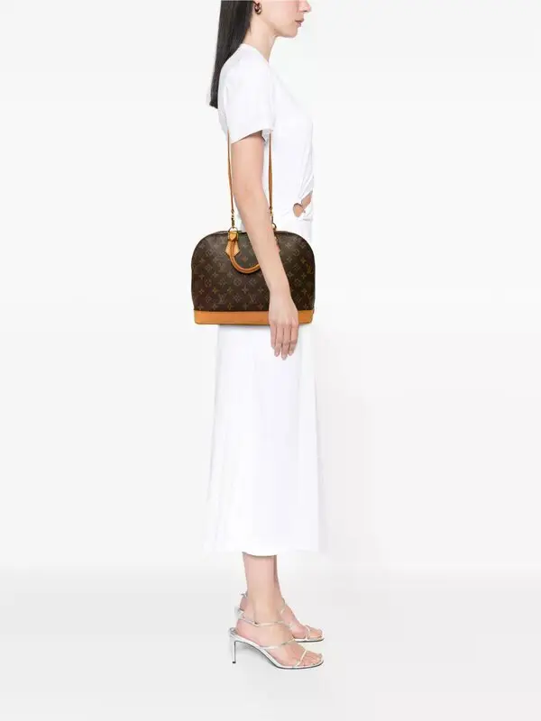 LOUIS VUITTON 1996 Monogram Alma Pm Handbag