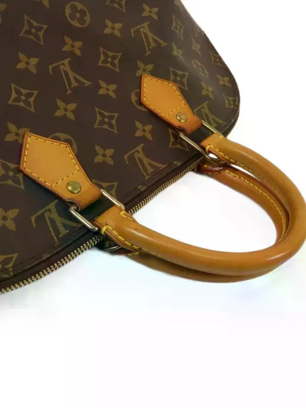 LOUIS VUITTON Alma Monogram Handbag