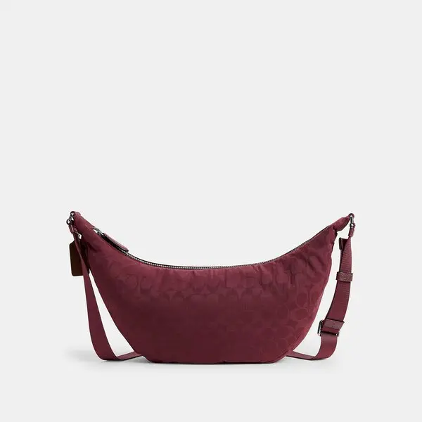 COACH Leon Sling Bag In Signature Nylon Jacquard - Light Maroon