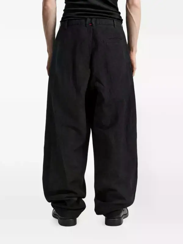 CASEY CASEY Pleated-detail Button-flap Trousers