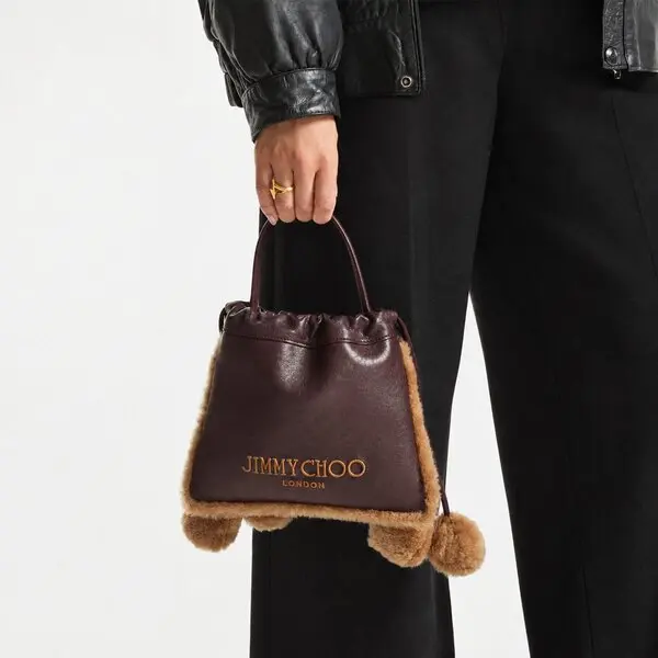 JIMMY CHOO Drawstring Pouch Top Handle Chocolate And Toffee Biker Leather And Shearling Drawstring Pouch With Pom-poms