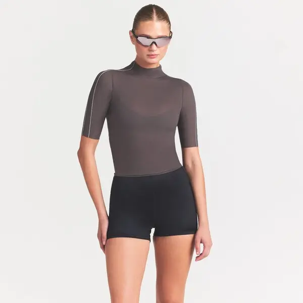 SKIMS Mock Neck Short Sleeve T Shirt | Grey | | Nike Weightless Layers
