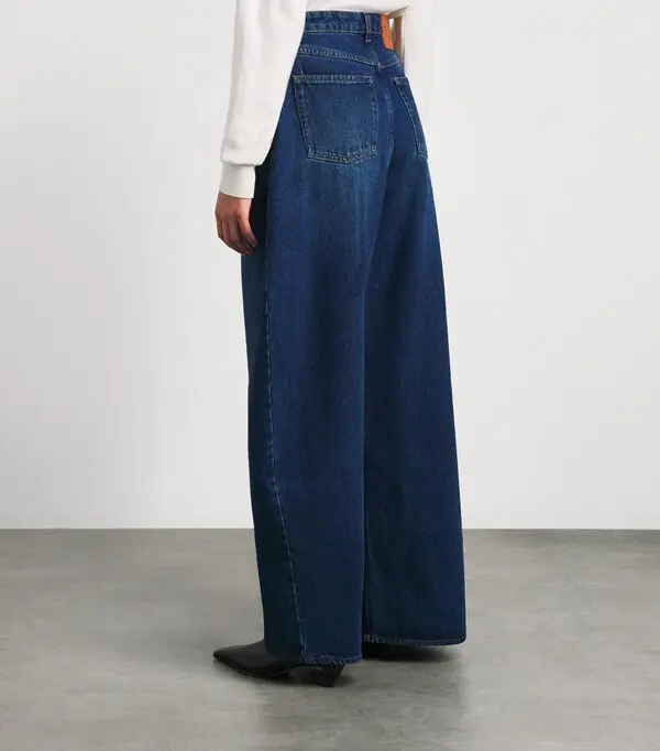A.W.A.K.E. Mode Asymmetric Wrap-detail Jeans