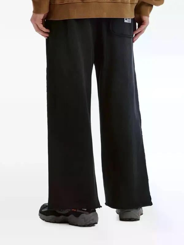 FINGERCROXX Logo-embroidered Raw-edge Trousers