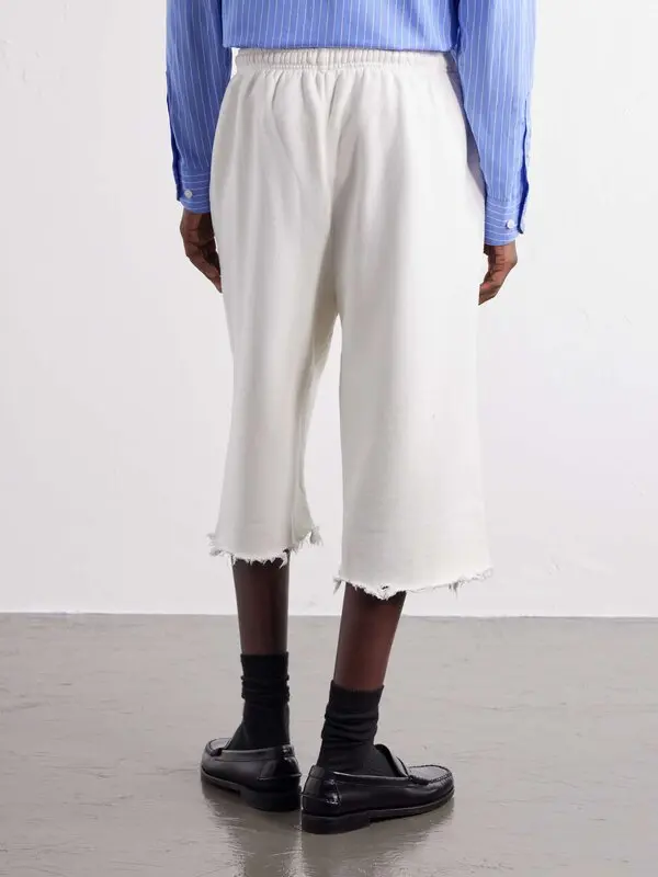 WILLY CHAVARRIA Community Center Distressed Logo-print Cotton-jersey Shorts