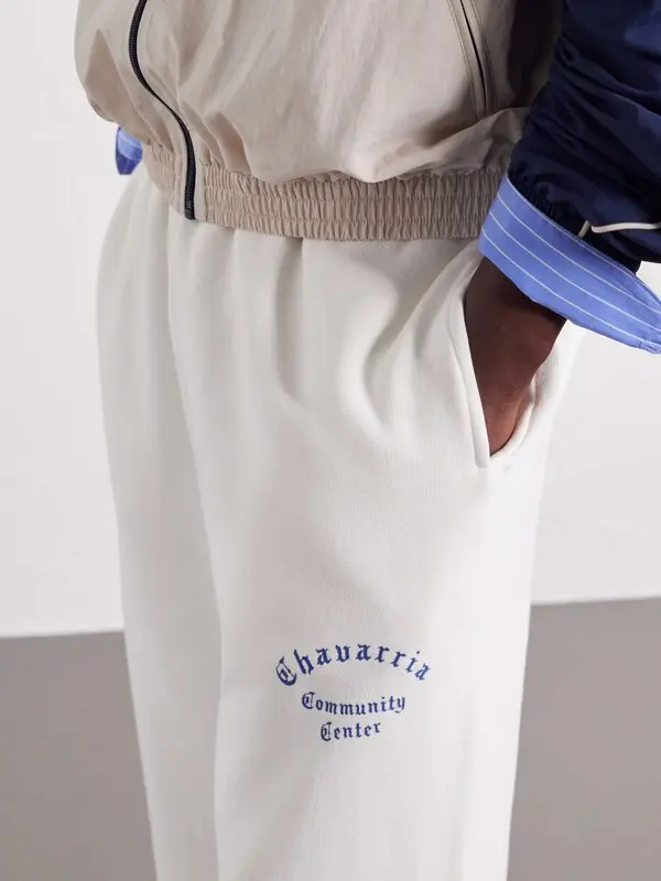 WILLY CHAVARRIA Community Center Distressed Logo-print Cotton-jersey Shorts