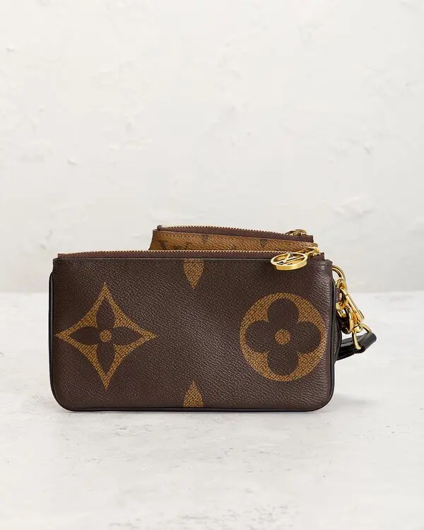 FWRD RENEW Louis Vuitton Reverse Monogram Giant Trio Pouch