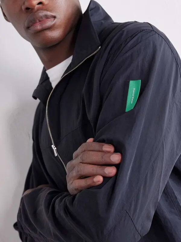 DISTRICT VISION Logo-appliquéd Half-zip Shell Running Jacket