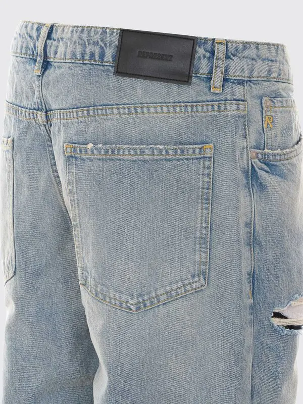 REPRESENT Distressed Cotton Denim Flared Jeans With A Worn-out Effect