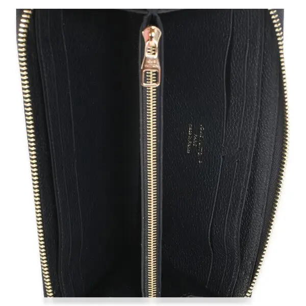 LOUIS VUITTON Beige Giant Monogram Empreinte Zippy Wallet