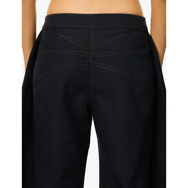 Alaïa Petal Curved-leg Wool Denim Trousers