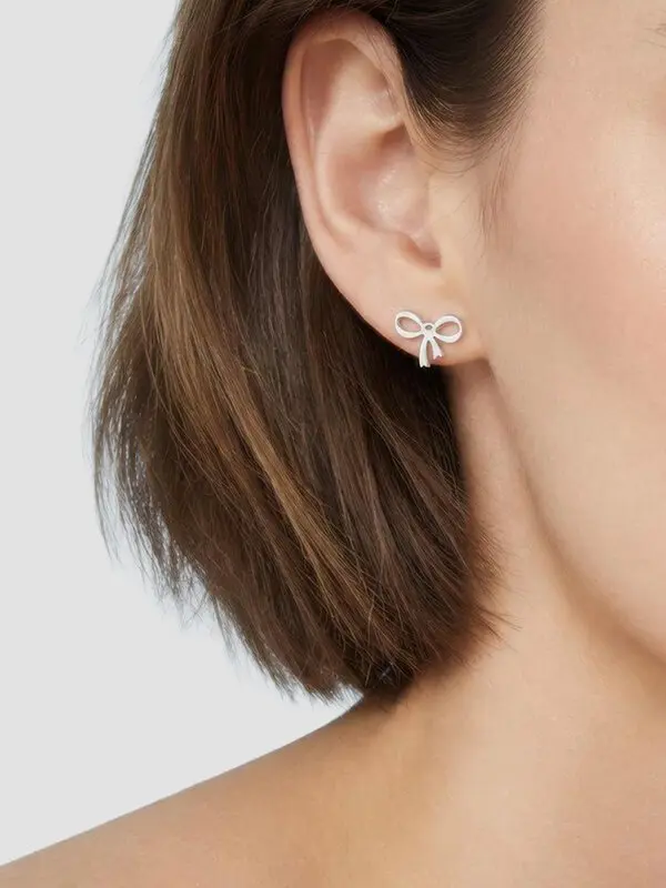 ORADINA Wrap Me Up Bow Studs In Sterling