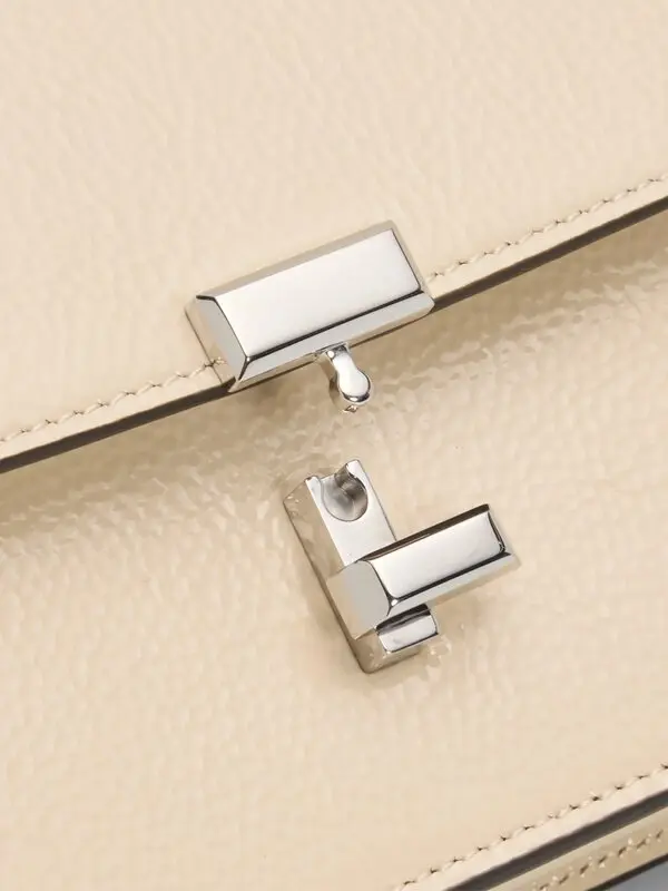 TOTEME T-lock Grained-patent Leather Crossbody Bag - Stone