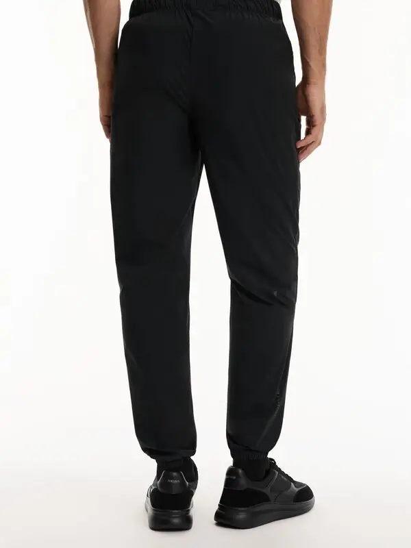 REISS Jogger Woven Jogger | Castore Technical Woven Cuffed Joggers