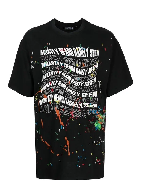 MOSTLY HEARD RARELY SEEN Warped-logo Paint-splatter T-shirt - Black