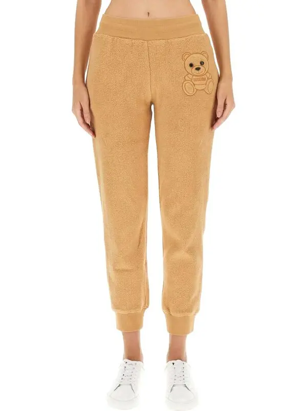 Moschino Jogging Pants With Embossed Logo - Beige