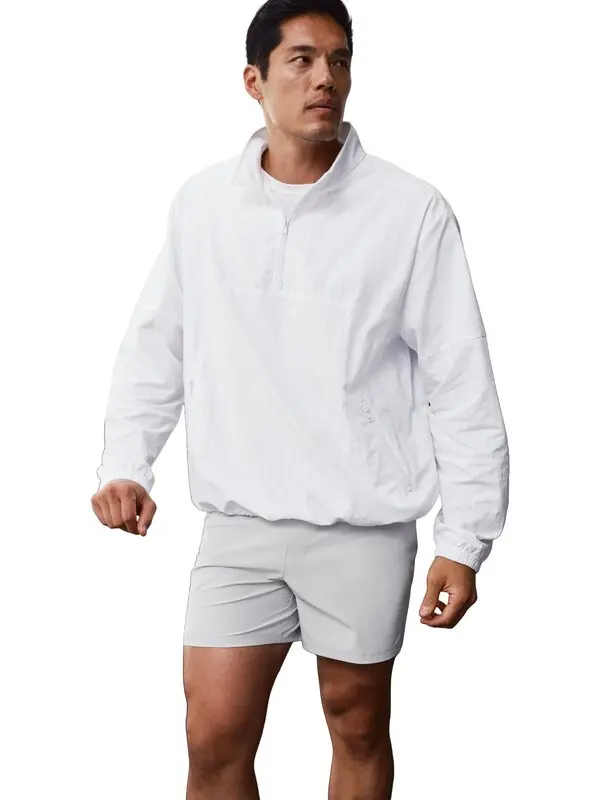 Alo Yoga Lightweight Track Pullover With Quarter-zip Neck And Zippered Pockets - White