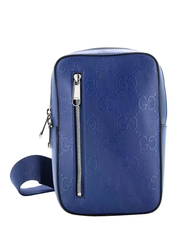 Gucci Sling Gg Embossed Perforated Leather Backpack - Blue