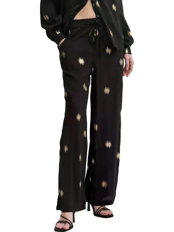 NEVER FULLY DRESSED Sun-print Trousers - Black