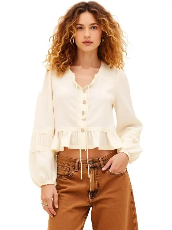 MODENAIRE Textured Peplum Blouse With Ruffle Sleeves - Ivory