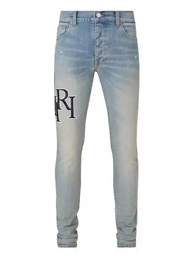 Amiri Staggered Embroidered Logo Jeans - Vintage Indigo