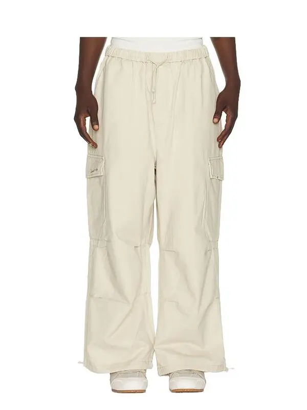 DRMERS CLUB Smiley Logo Parachute Pants - Light Beige
