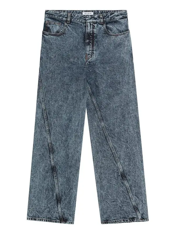 Alaïa Twisted Stonewashed Denim Jeans - Blue