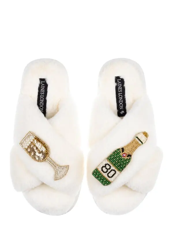 LAINES LONDON Faux Fur Cross Strap Slippers With Champagne And 80th Birthday Brooches - White