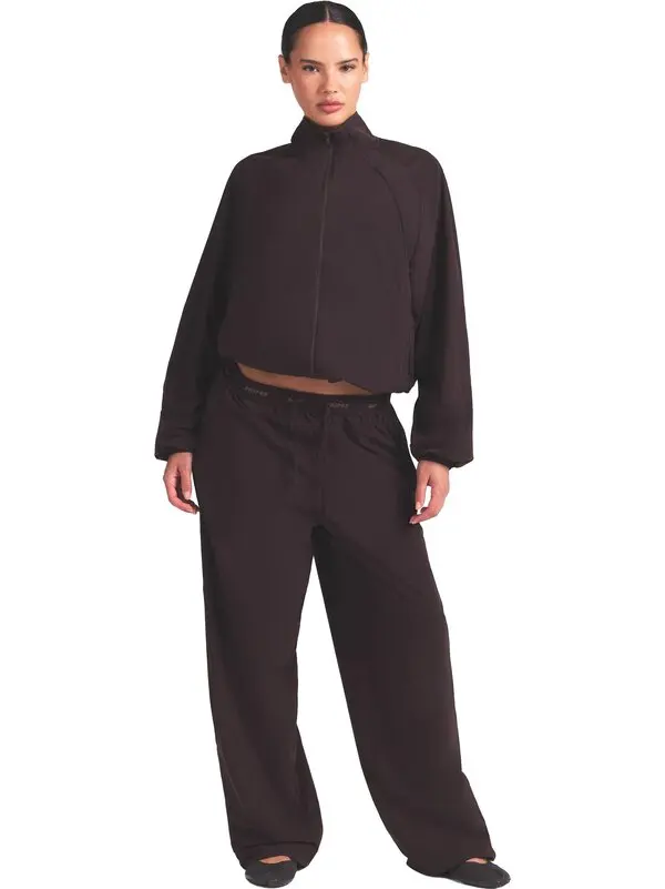 SKIMS Oversized Stretch Nylon Pants - Dark Roast