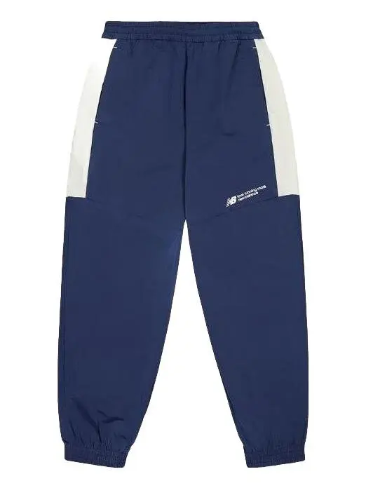 NEW BALANCE Woven Track Pants Asia Sizing - Navy