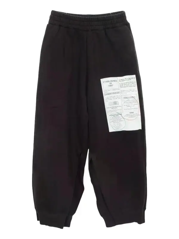 MAISON MARGIELA Newspaper Print Track Pants - Black
