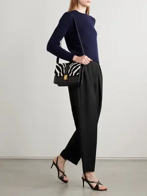 Khaite Dugan Pleated Wool Tapered Trousers