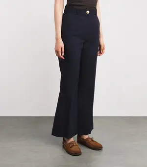 Sandro Wool-blend Flared Trousers With Gold-tone Button Detail