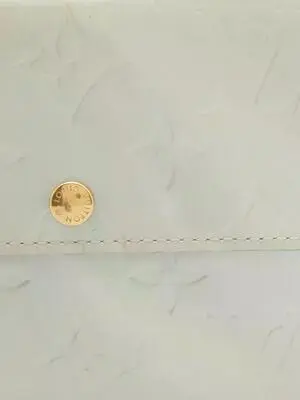 LOUIS VUITTON Monogram-debossed Leather Wallet