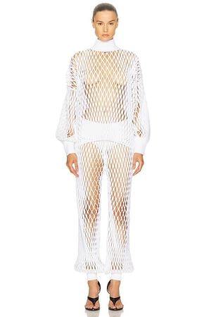 Alaïa Long Sleeve Open Knit Turtleneck Top