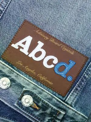 ADVISORY BOARD CRYSTALS Shearling-lined Denim Jacket
