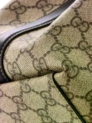 Gucci Gg Emblem Gg Coated Canvas Medium Bucket Bag
