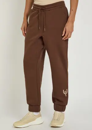 NOW YOU LIVE Magna Logo-embroidered Cotton-blend Sweatpants
