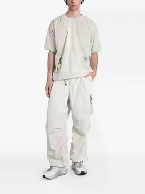 AND WANDER Pertex Quantum Air Logo-print Zip-pocket T-shirt