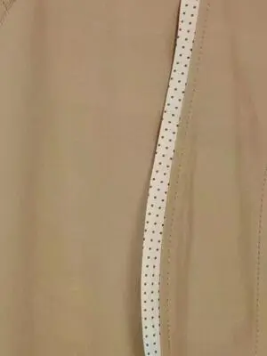 Undercover Asymmetric Hem Trench Coat