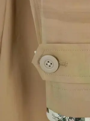 Undercover Asymmetric Hem Trench Coat
