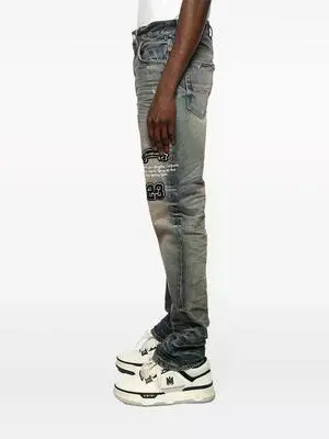 Amiri Distressed Logo Patch Jeans