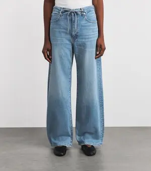 FRAME The Bow High-rise Barrel-leg Jeans In Light Wash Denim - Blue