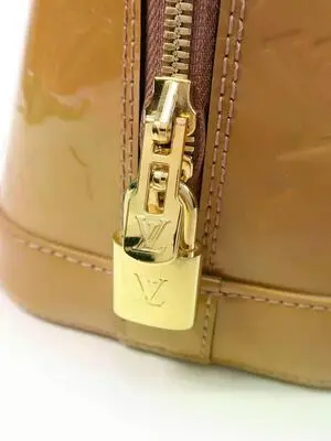 LOUIS VUITTON Monogram Vernis Alma Handbag - Yellow