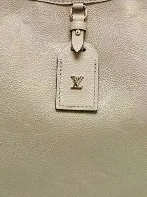 LOUIS VUITTON Carryall Mm Monogram Giant Empreinte Shoulder Bag - Neutrals