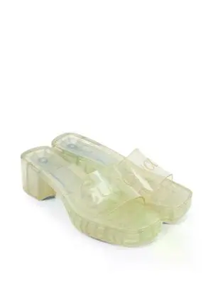 Gucci Embossed Logo Mules